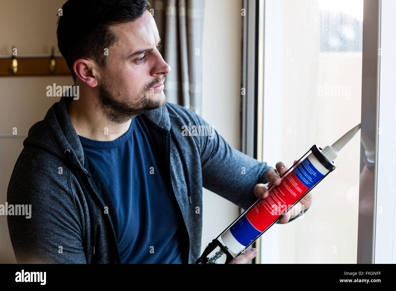 Man using pest control injection Stock Photo - Alamy