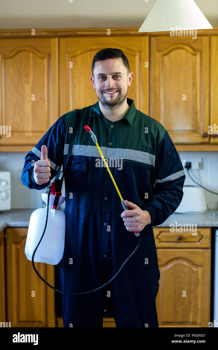 Portrait of pest control man spraying pesticide Stock Photo - Alamy