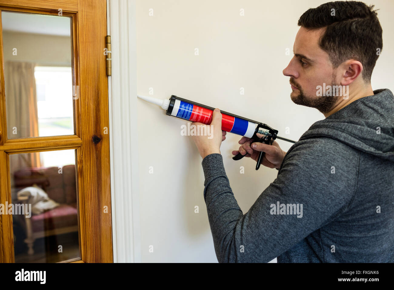 Man using pest control injection Stock Photo - Alamy