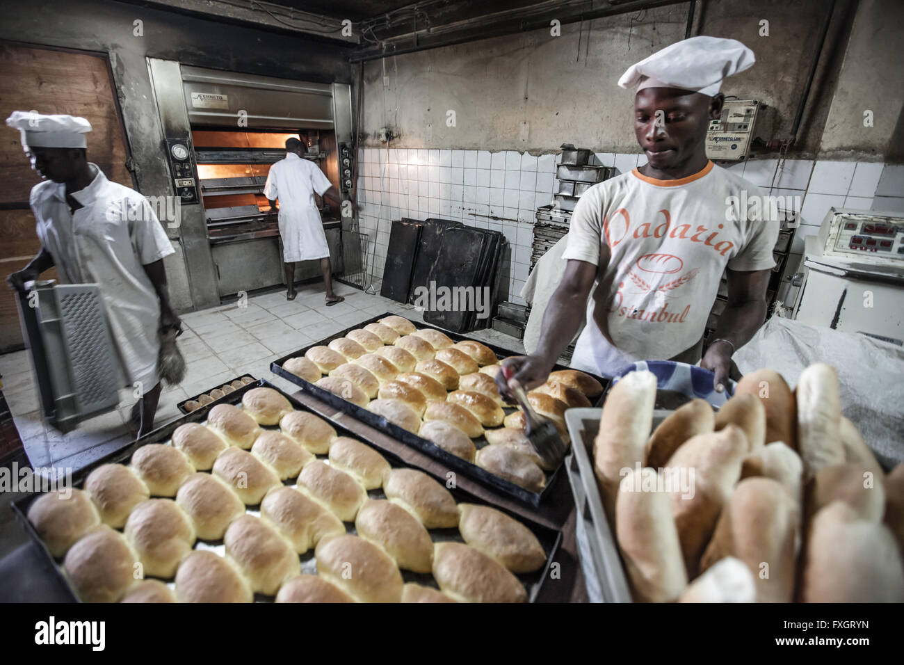 Mozambique, men are baking bread in bakery traditional cousin Stock ...