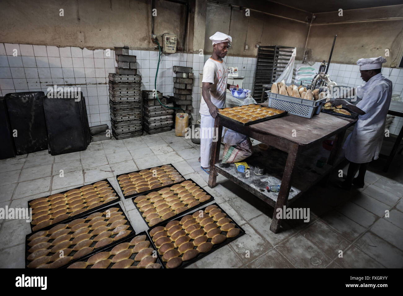 Mozambique, men are baking bread in bakery traditional cousin Stock ...