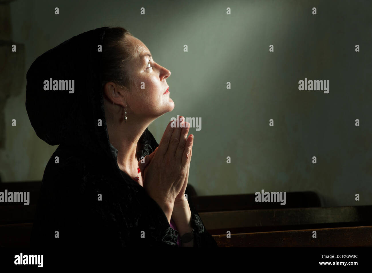 Lady At Prayer Stock Photo - Alamy