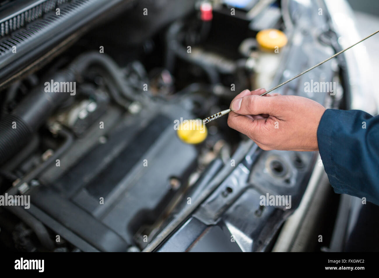 Checking oil level hi-res stock photography and images - Alamy