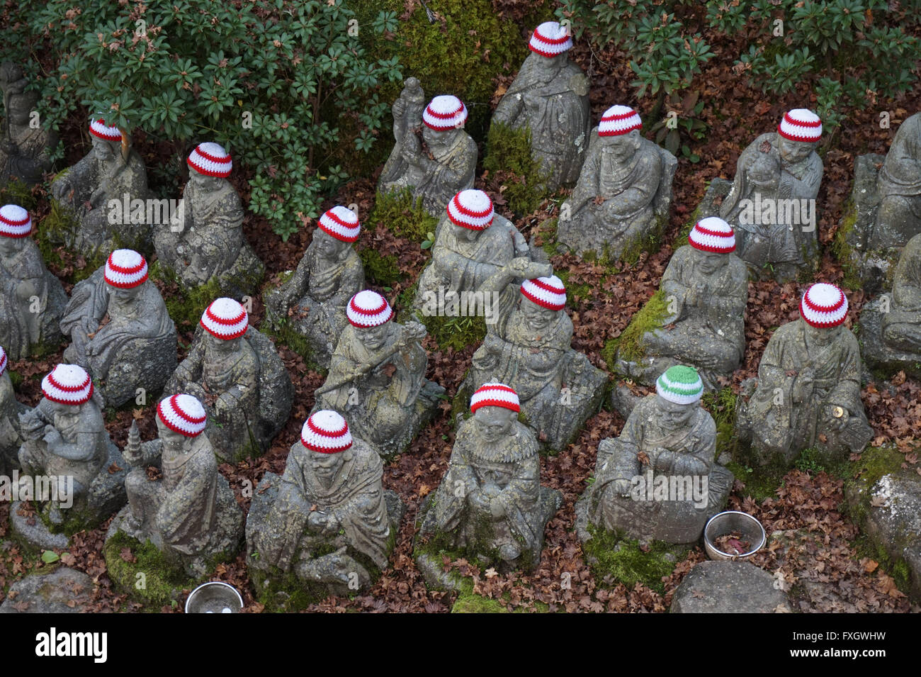 Statues wearing woolen hats at the Buddhist temple of Daisho-in on ...