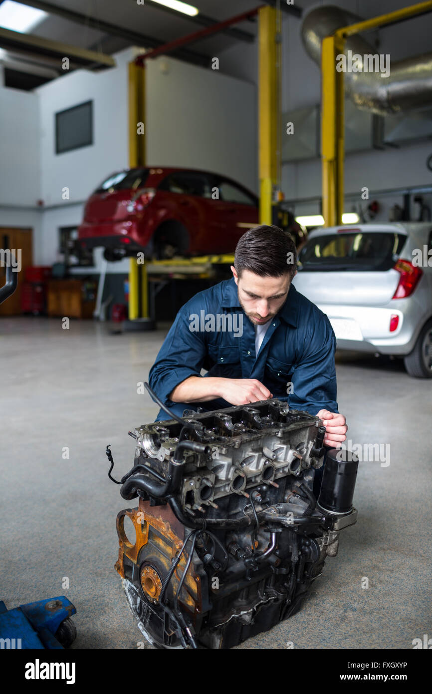 Mechanic working on an engine Stock Photo - Alamy