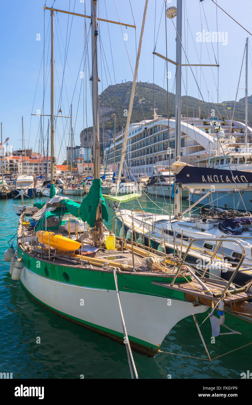 Gibraltar. Yachts moored in Marina Bay, beside Ocean Village. The Rock ...
