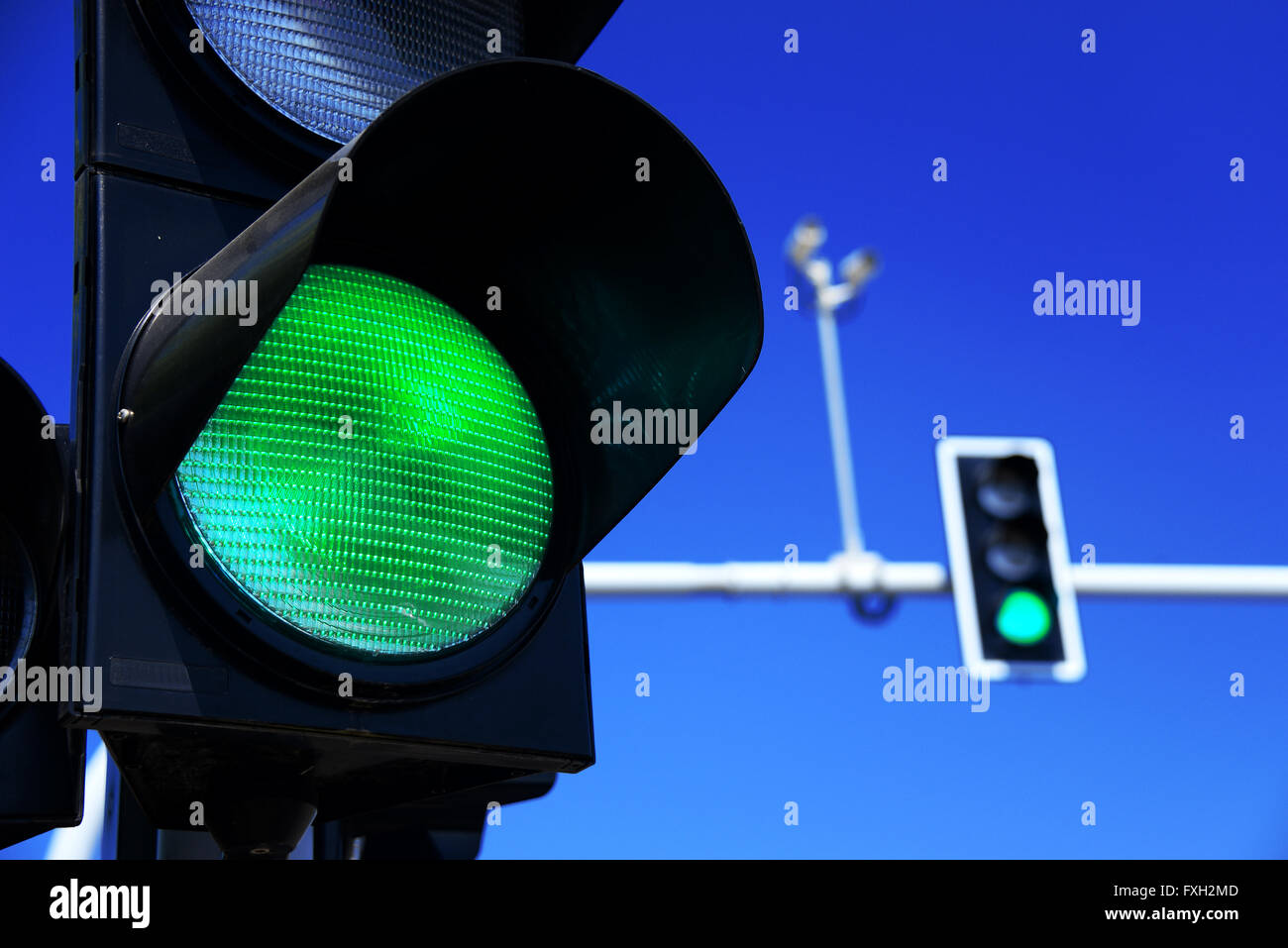 Traffic lights over blue sky Stock Photo - Alamy