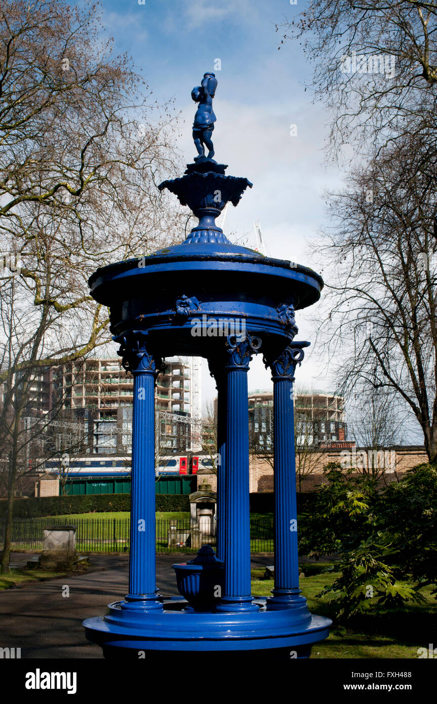 St Pancras Old Church yard.Blue painted fountain with statue on the top ...