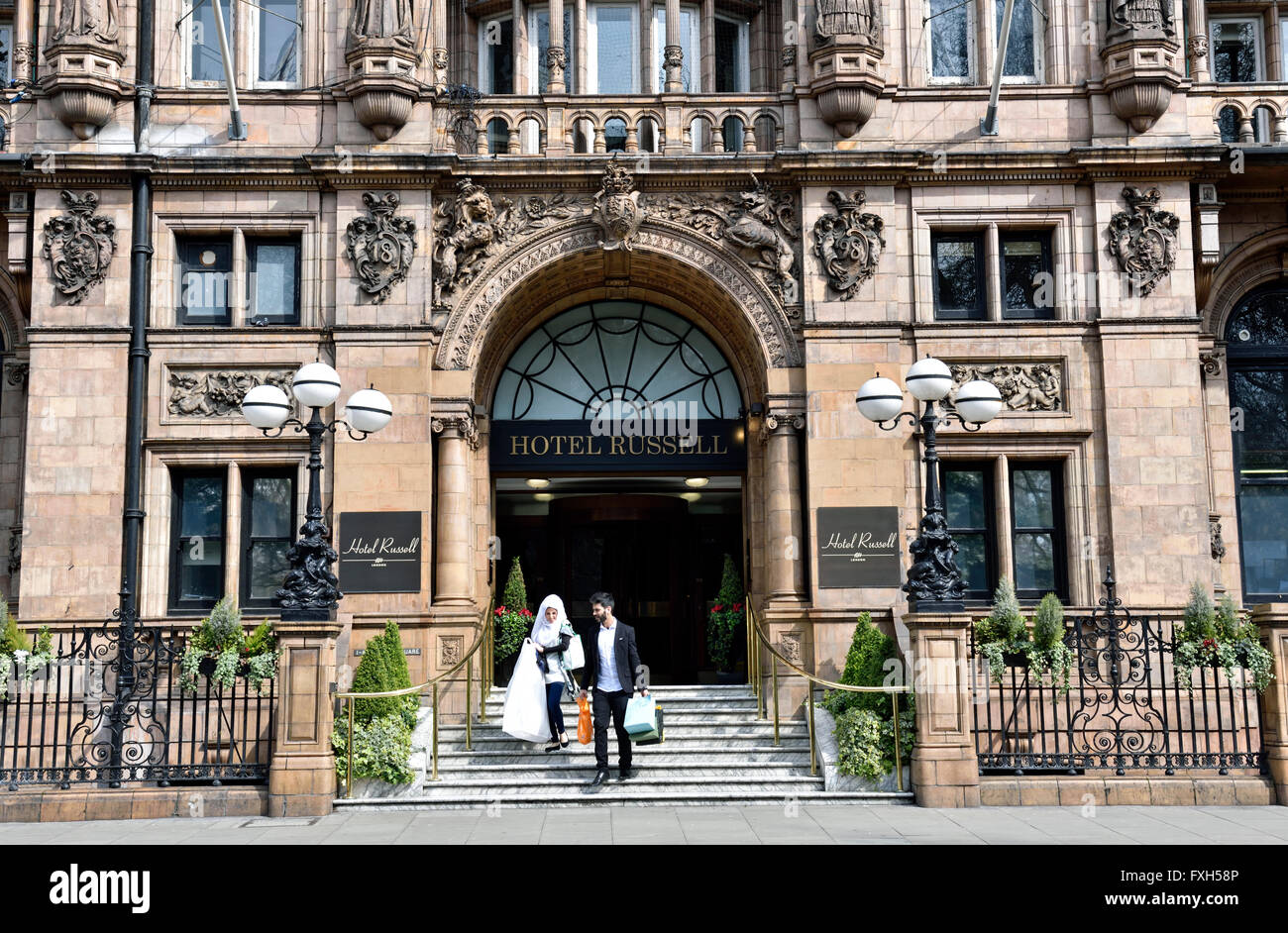 Young couple leaving Hotel Russell, Russell Square Bloomsbury London ...