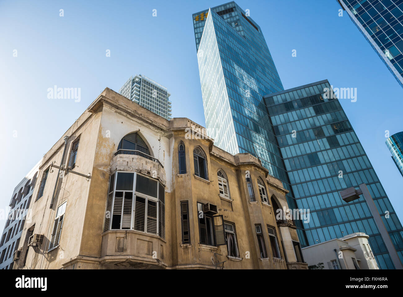 Abandoned house with First International Bank Tower on background in ...