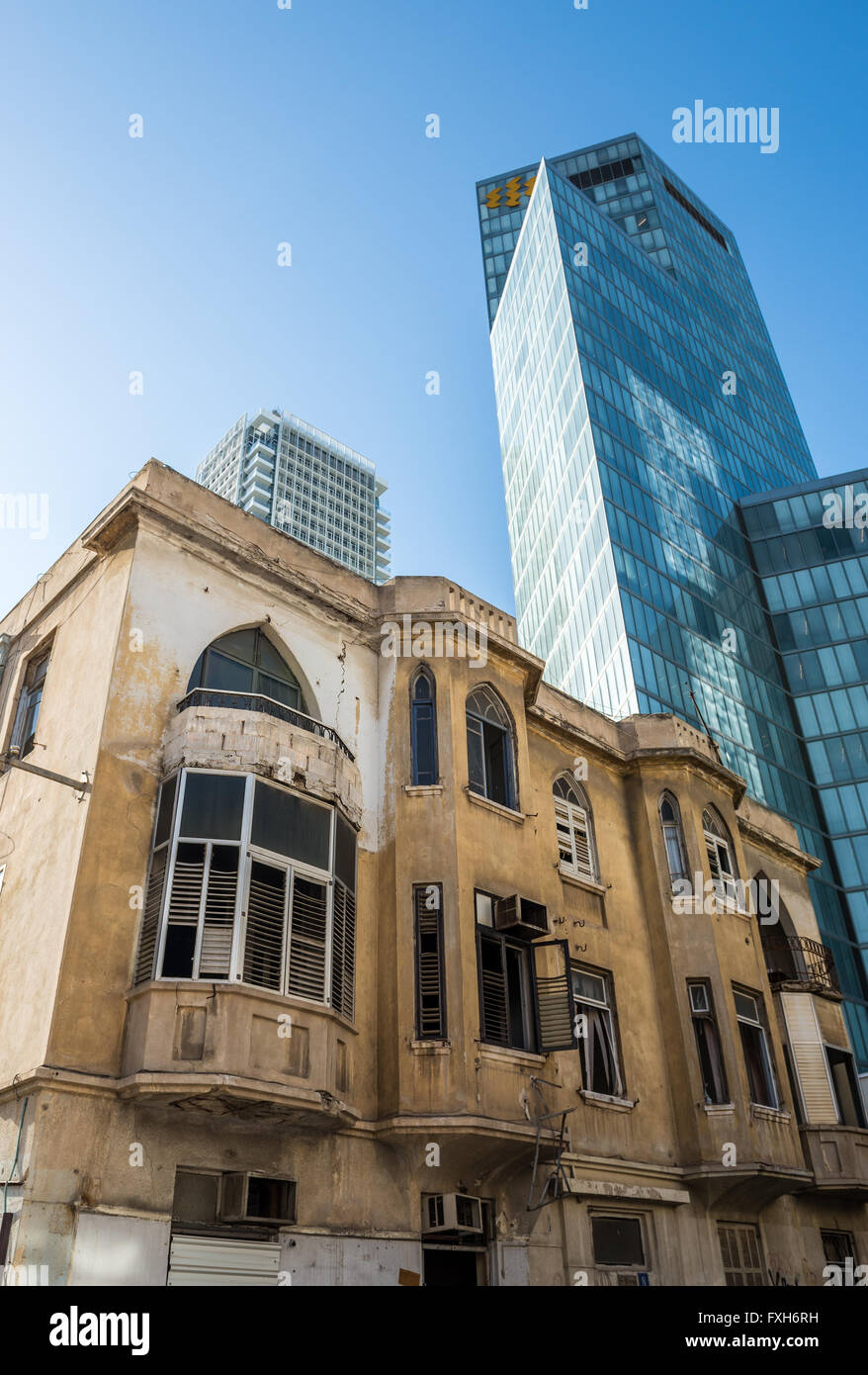 Abandoned house with First International Bank Tower on background in ...
