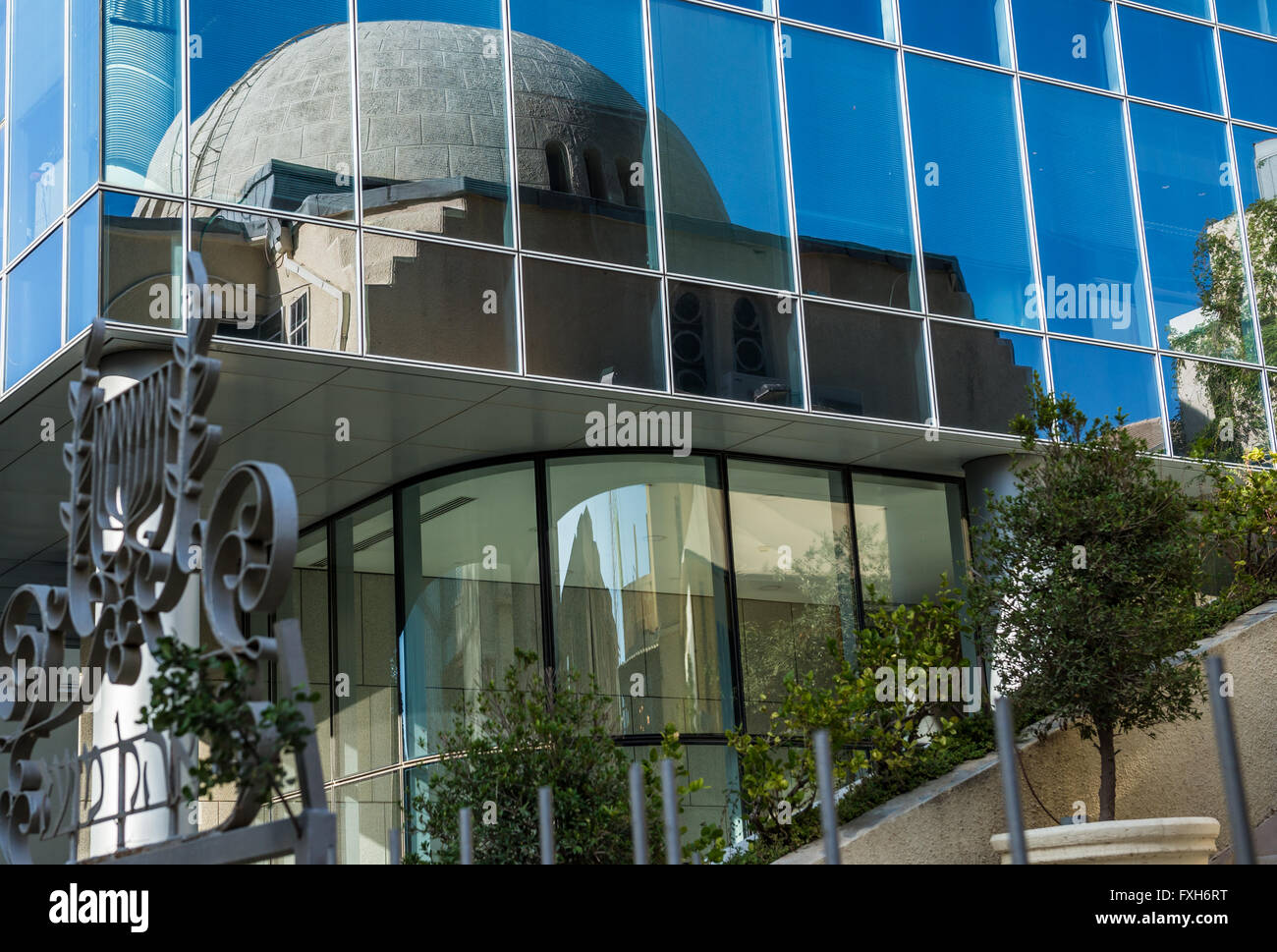 Old mosque reflection in modern office building in Tel Aviv city ...