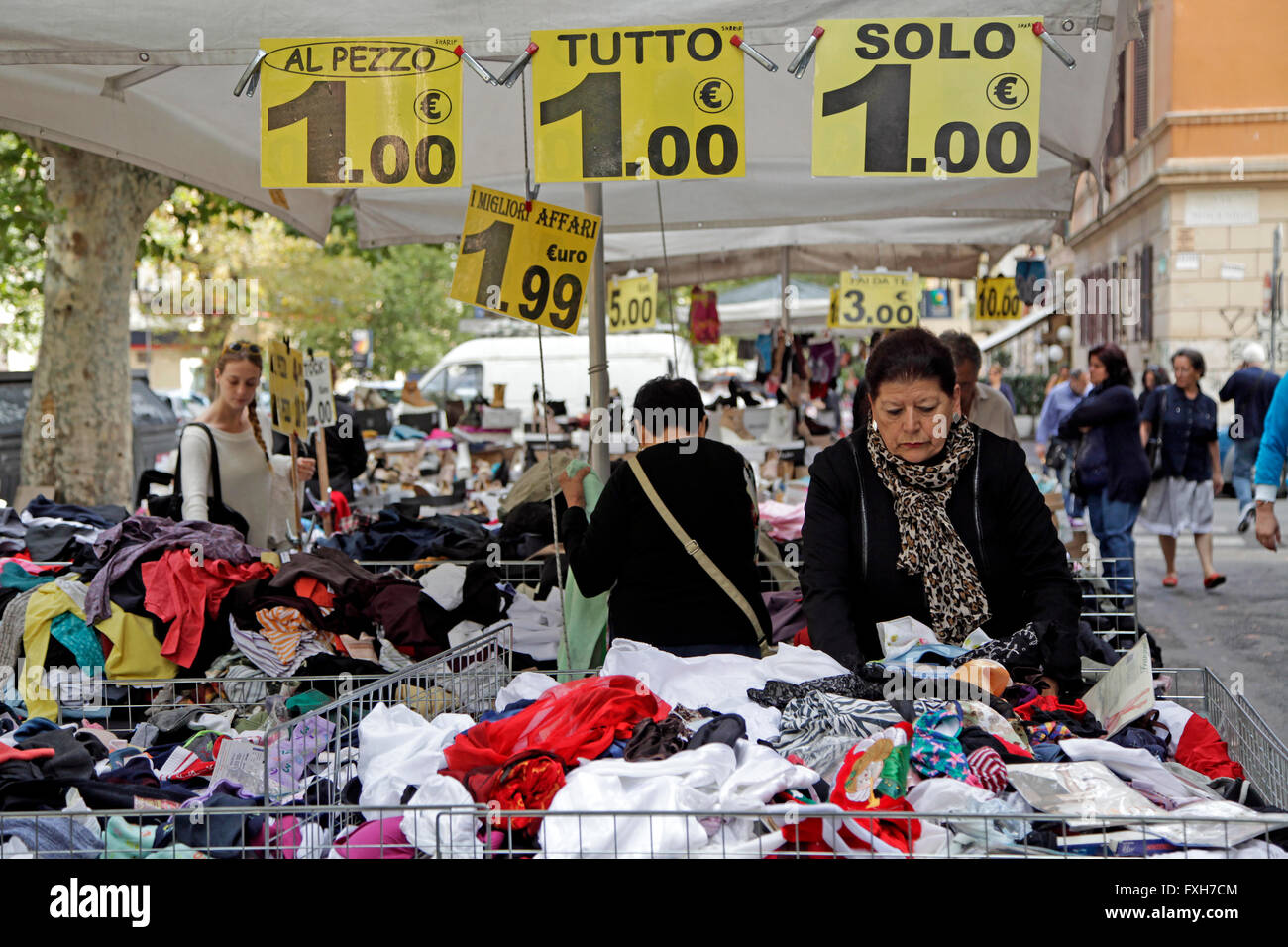 Price signs display the cost in euros of clothes on a stall at an ...
