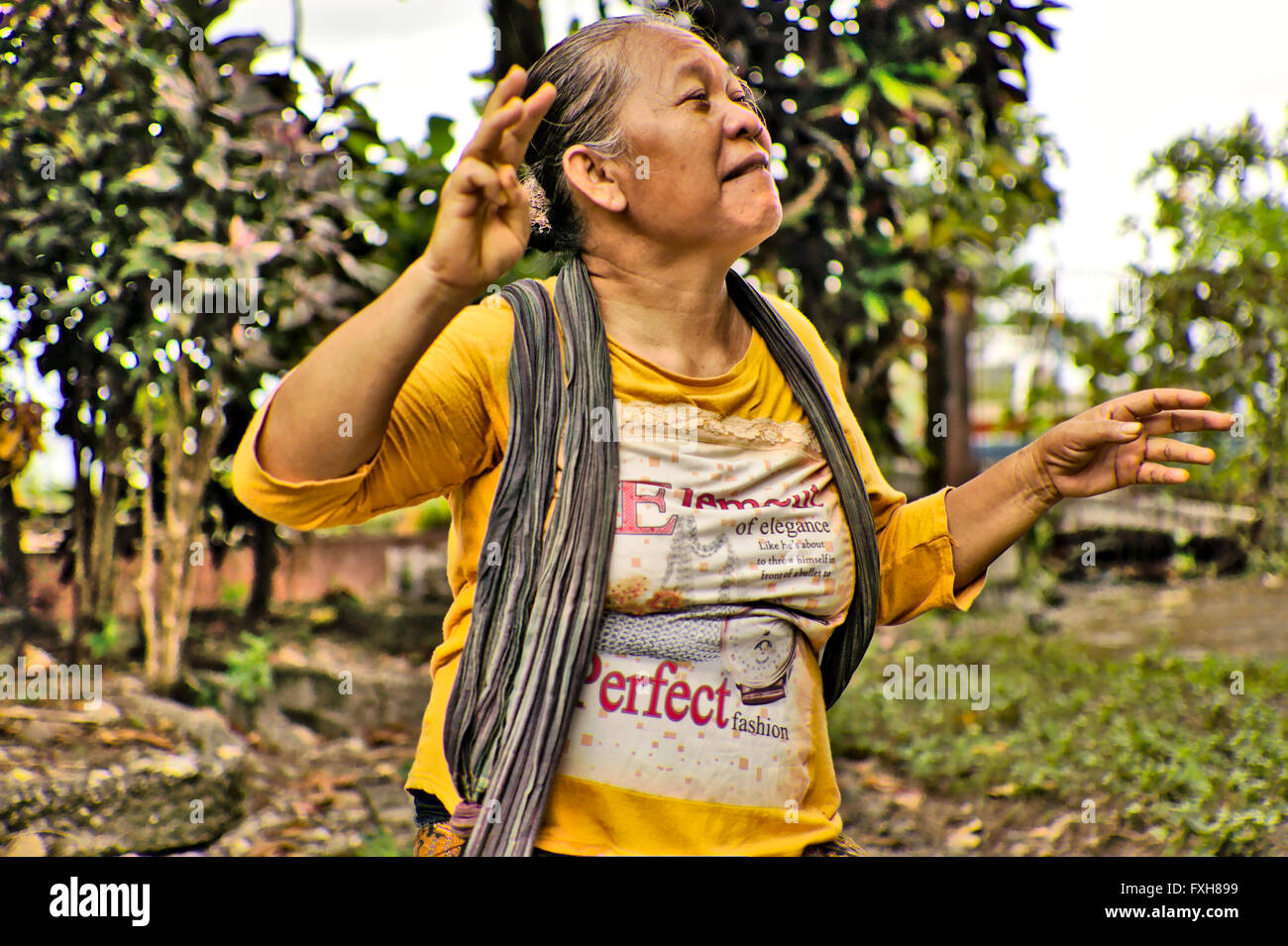 A Javaese woman seller of jamu, traditional Indonesian medicine, which ...