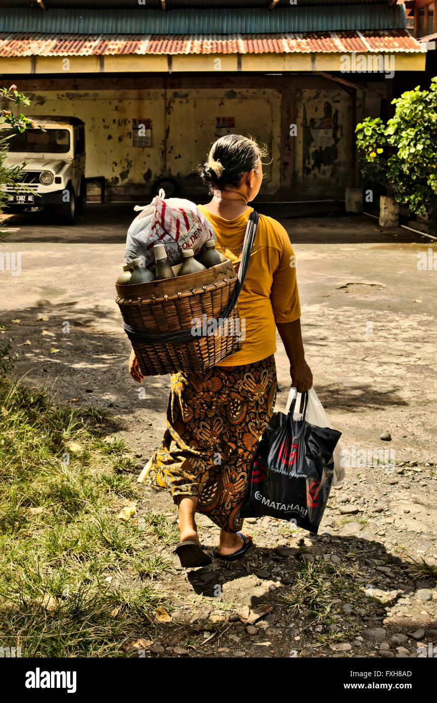 A Javanese woman seller of jamu, traditional Indonesian medicine, which ...