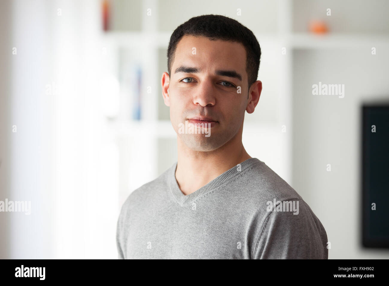 Happy young latin man hi-res stock photography and images - Alamy