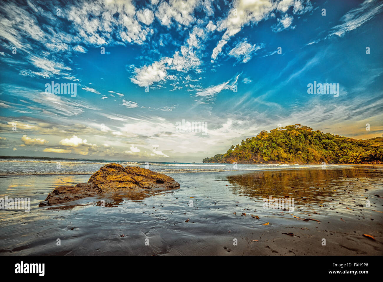 Rocks on the sand at Ventanas Beach, Costa Rica Stock Photo - Alamy