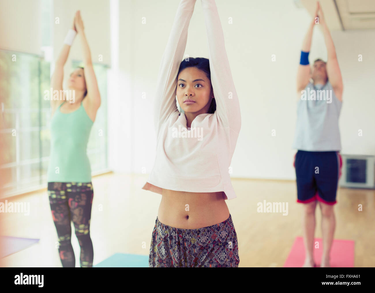 Woman arms overhead in yoga hi-res stock photography and images - Alamy