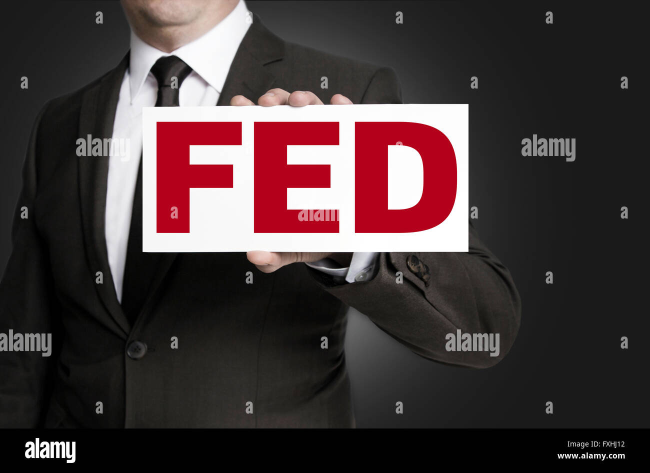 fed sign is held by businessman background Stock Photo - Alamy