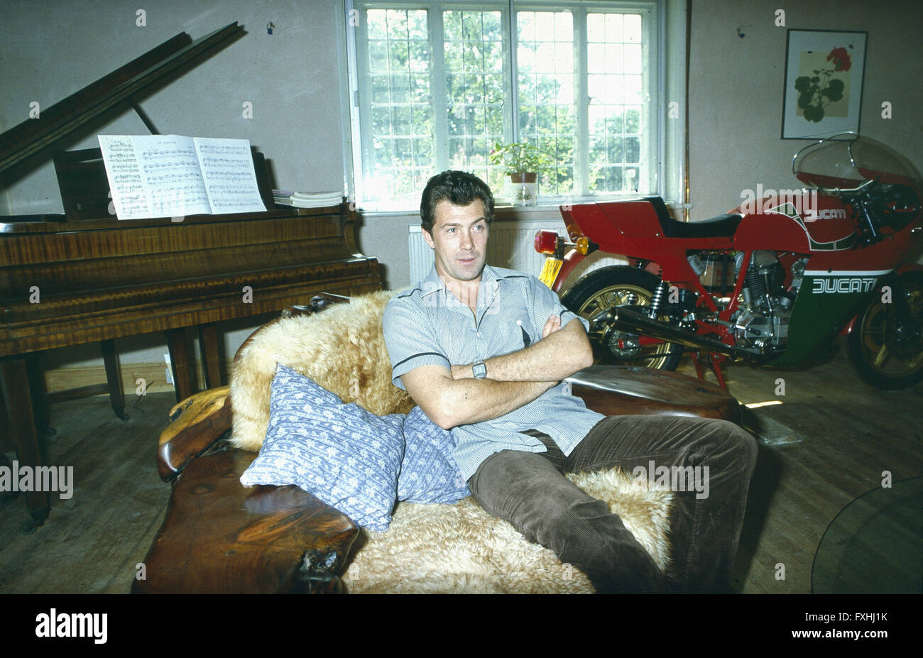 London. UK. ARCHIVE. Lewis Collins in the mid 1980s at his home and ...