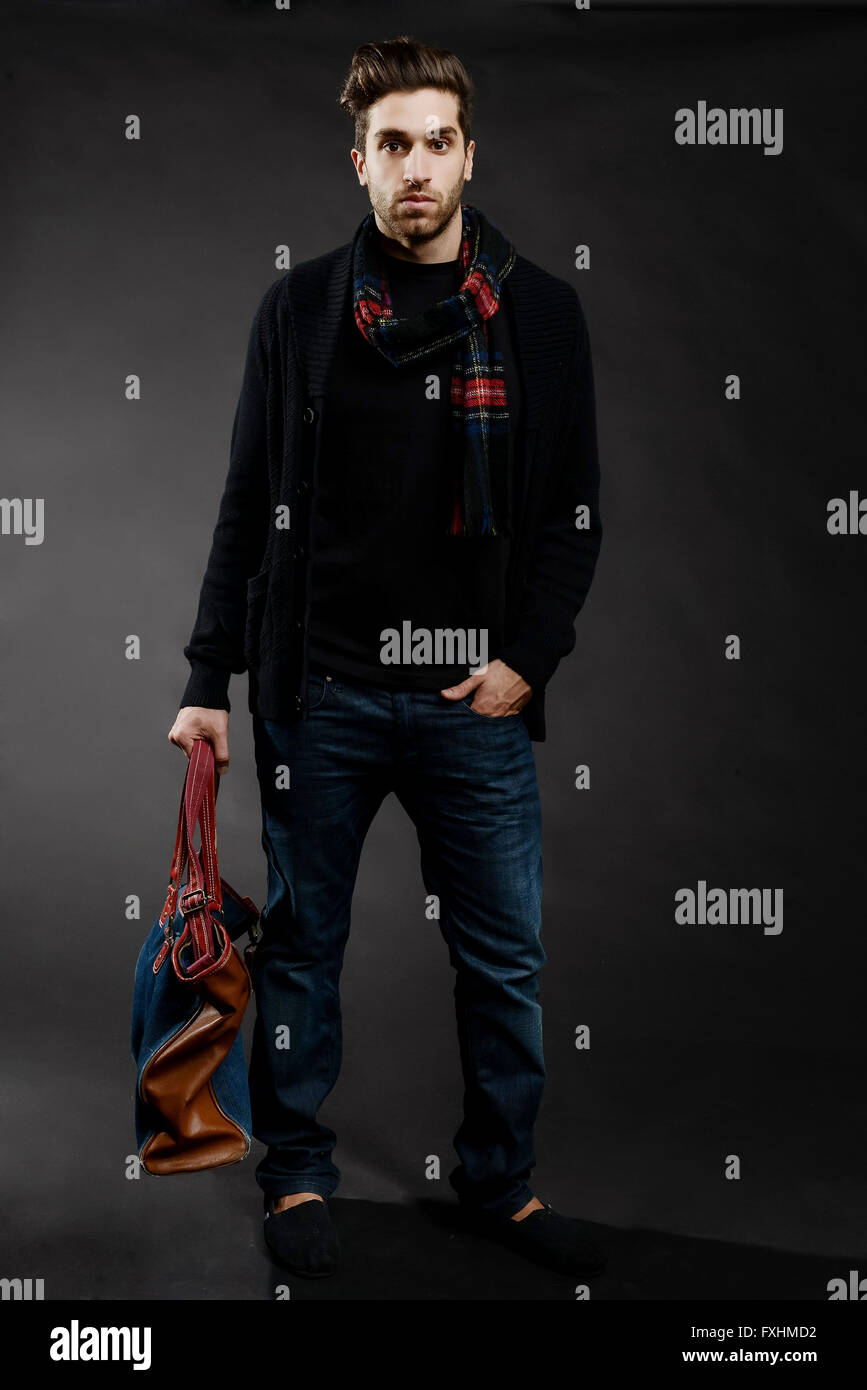 Male Model With Scarf and Bag Stock Photo - Alamy