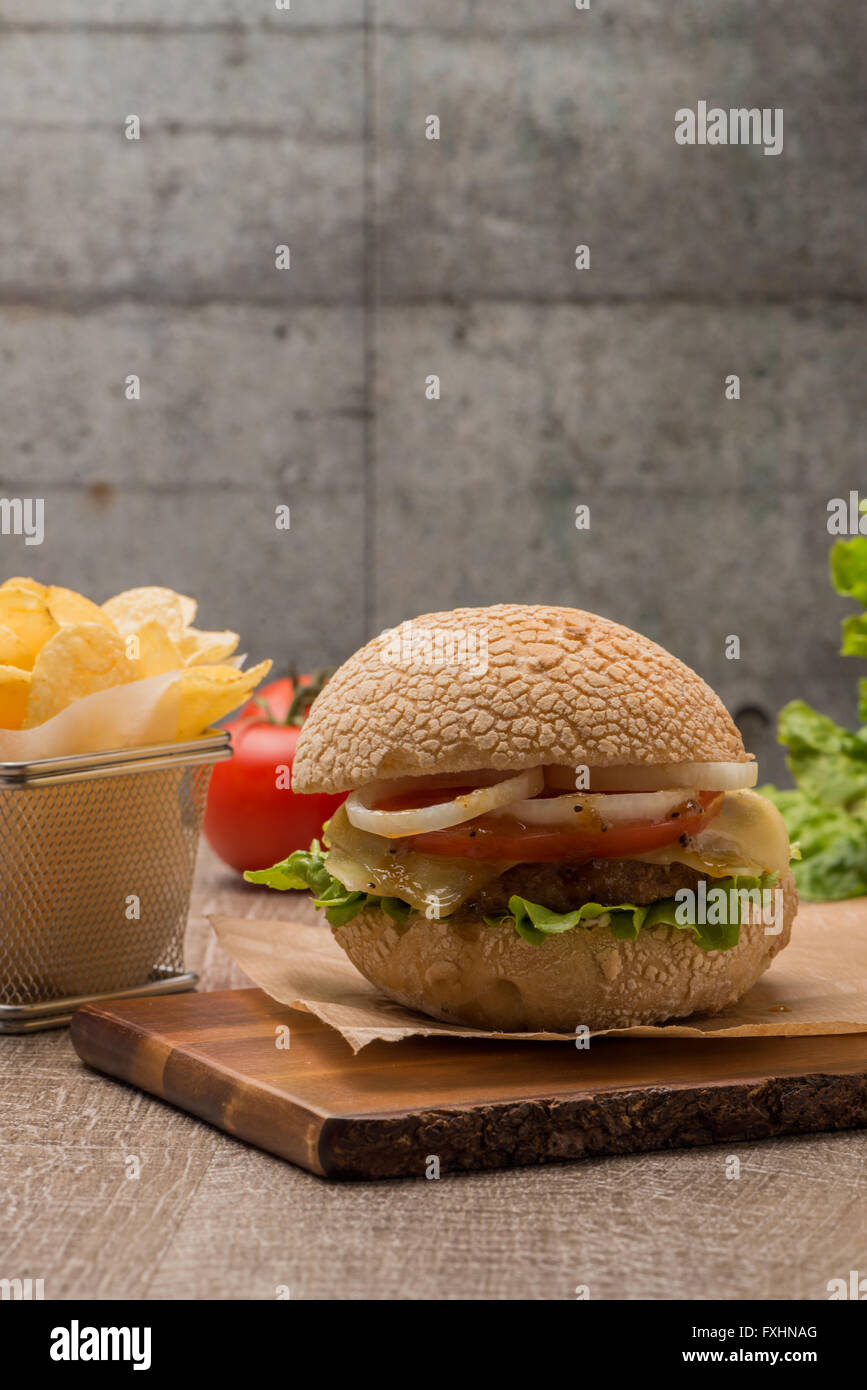 Homemade veggie burger served on wooden table Stock Photo - Alamy