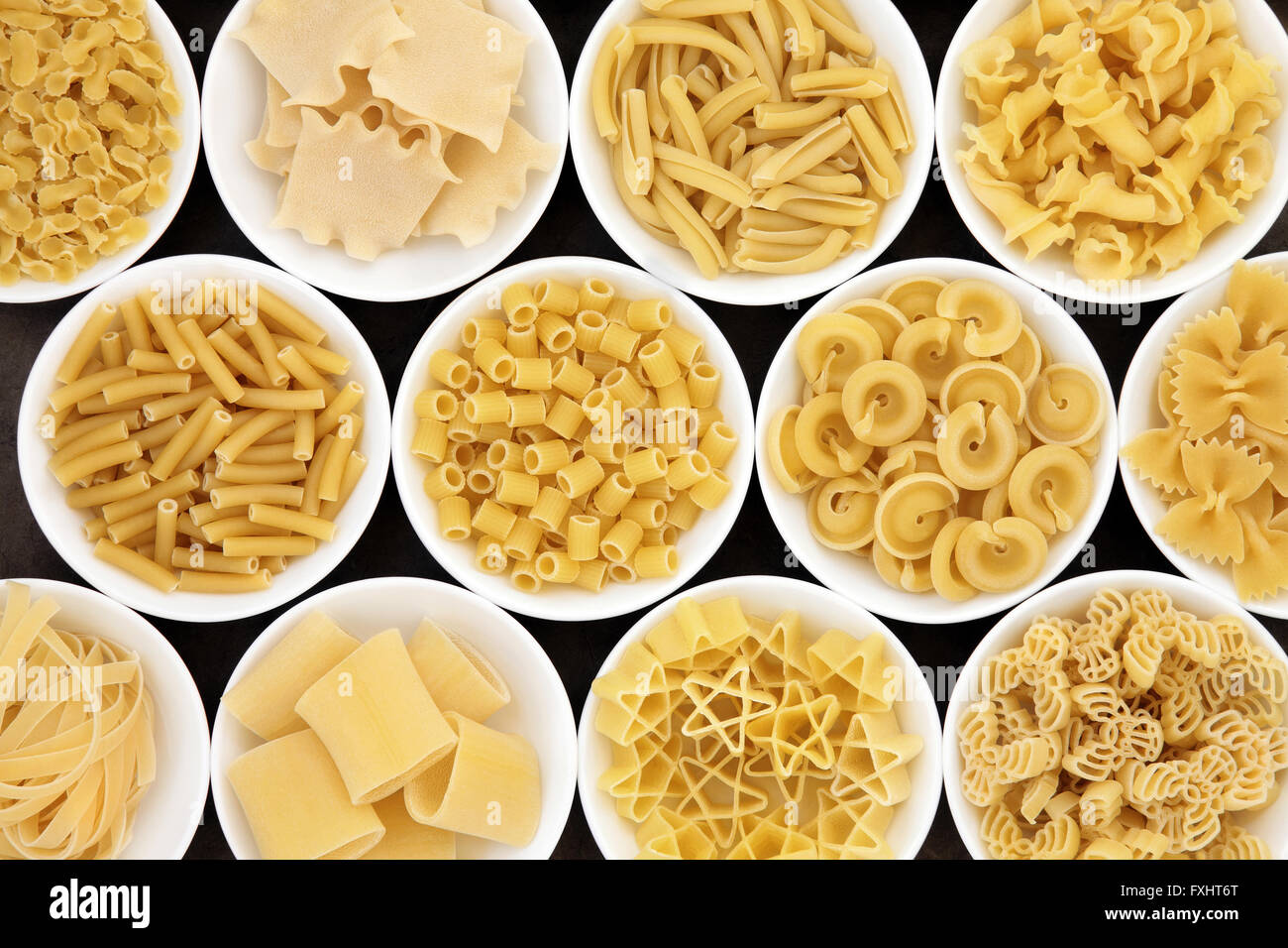 Pasta dried food selection close up in white porcelain bowls Stock ...