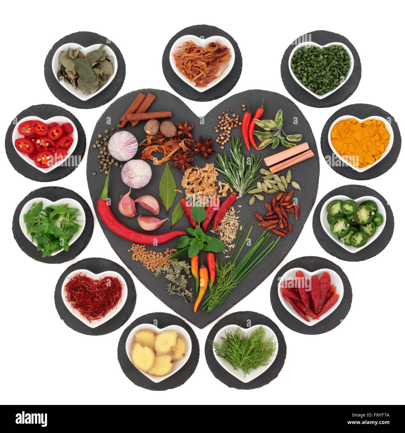 Herb and spice selection in porcelain dishes on heart and round shaped ...
