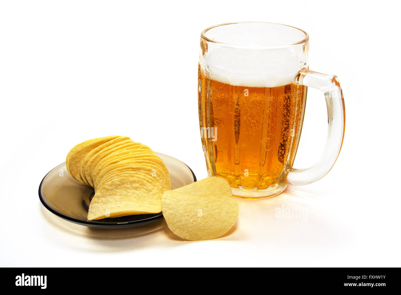 Mug of beer and chips Stock Photo - Alamy