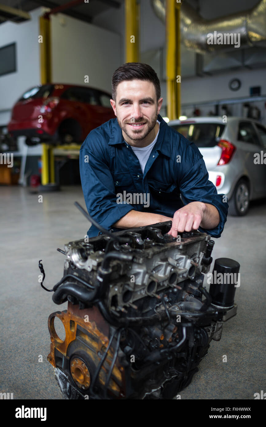 Mechanic working on an engine Stock Photo - Alamy