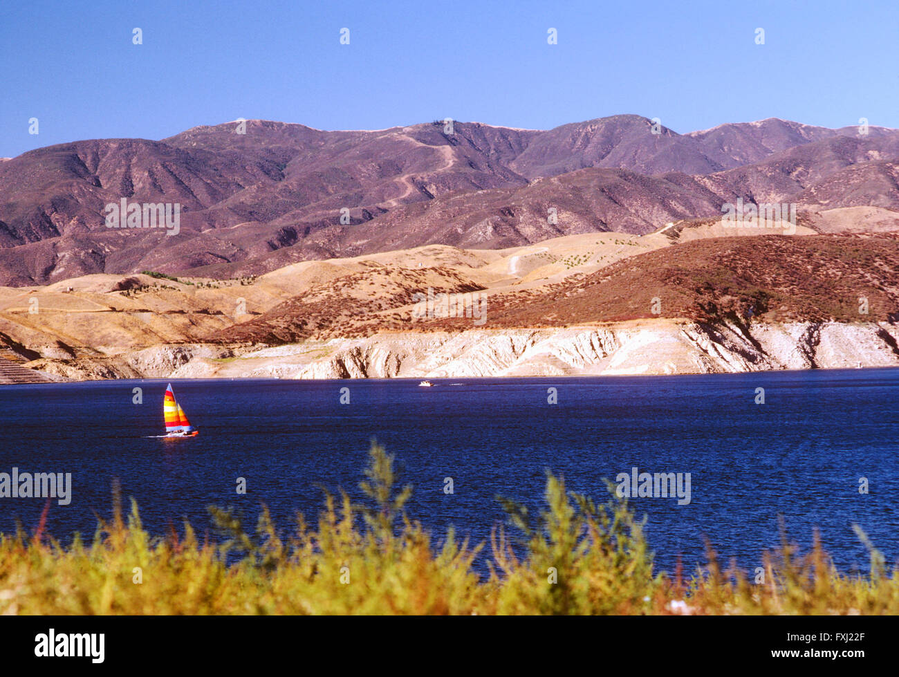Colorful sailboat on reservoir north of Los Angeles; California; USA ...