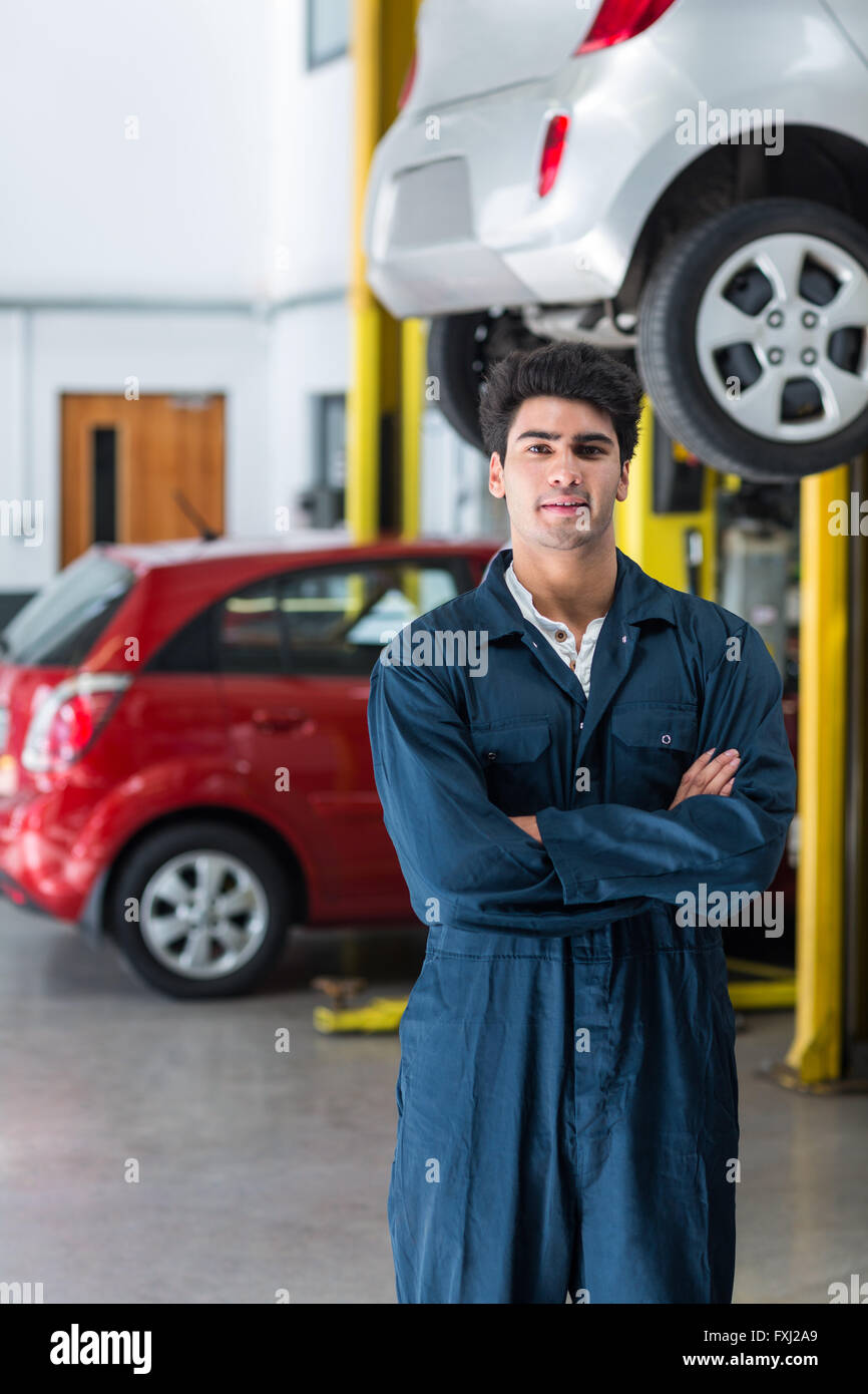 Mechanic with arms crossed Stock Photo - Alamy