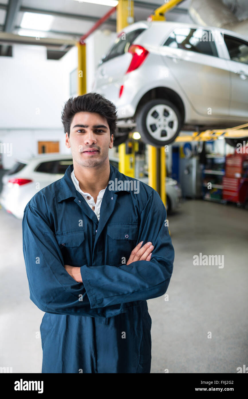 Mechanic with arms crossed Stock Photo - Alamy