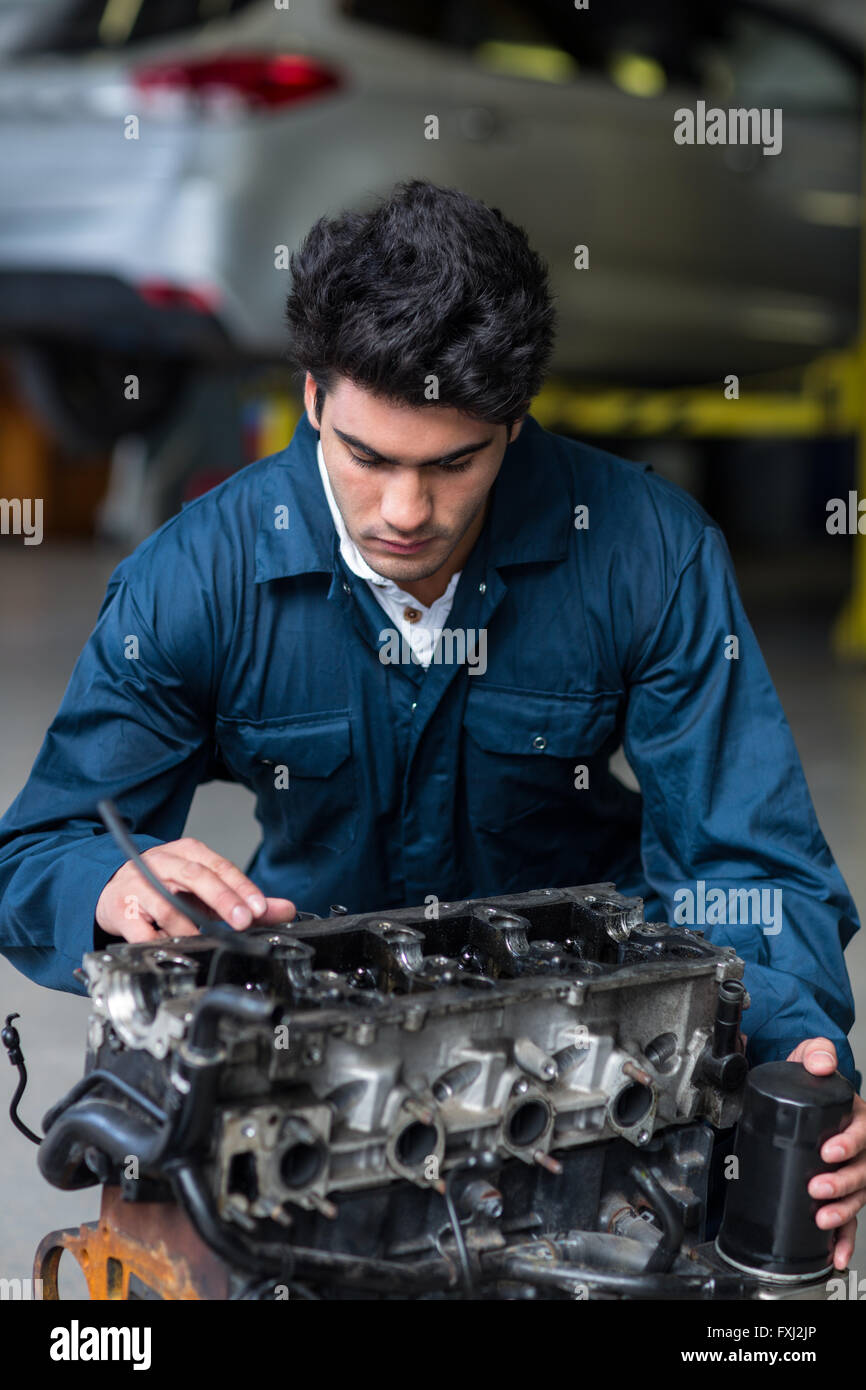 Mechanic working on an engine Stock Photo - Alamy