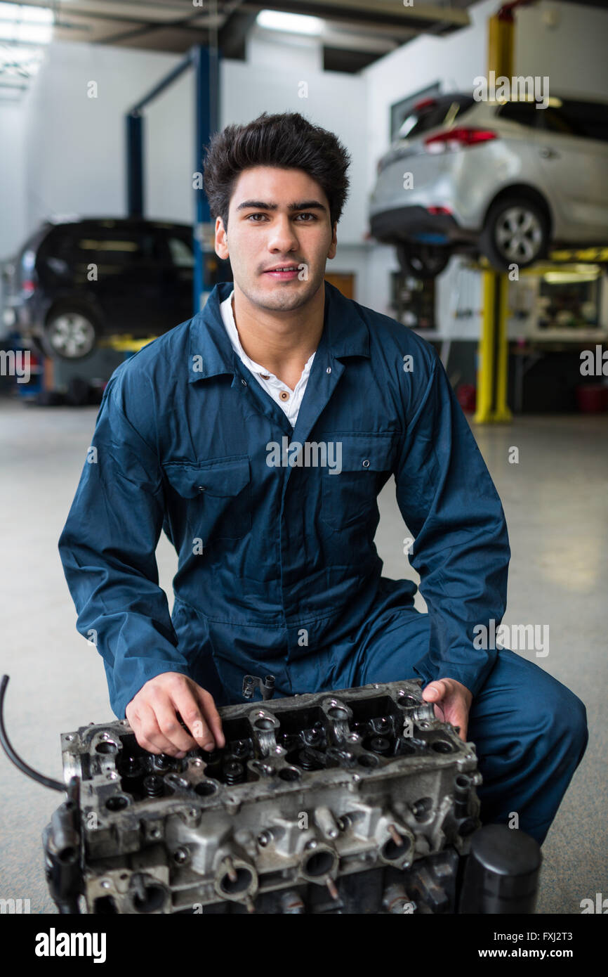 Mechanic working on an engine Stock Photo - Alamy