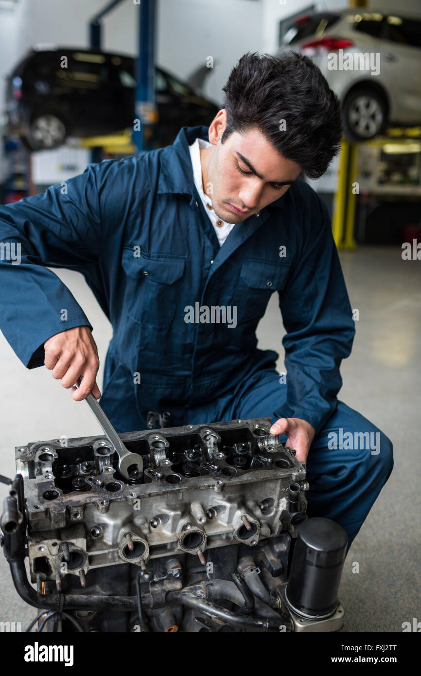 Mechanic working on an engine Stock Photo - Alamy