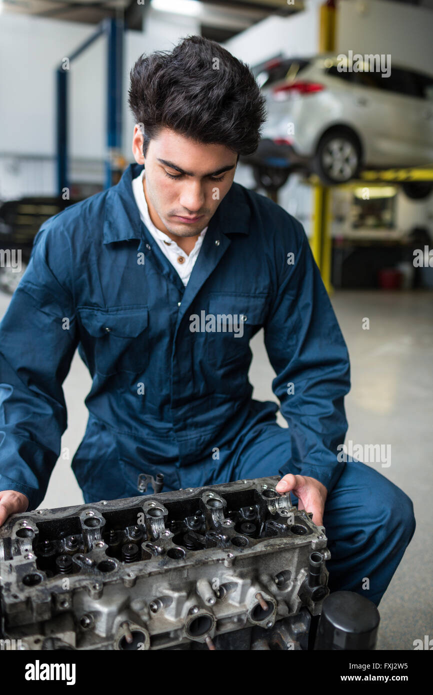 Mechanic working on an engine Stock Photo - Alamy