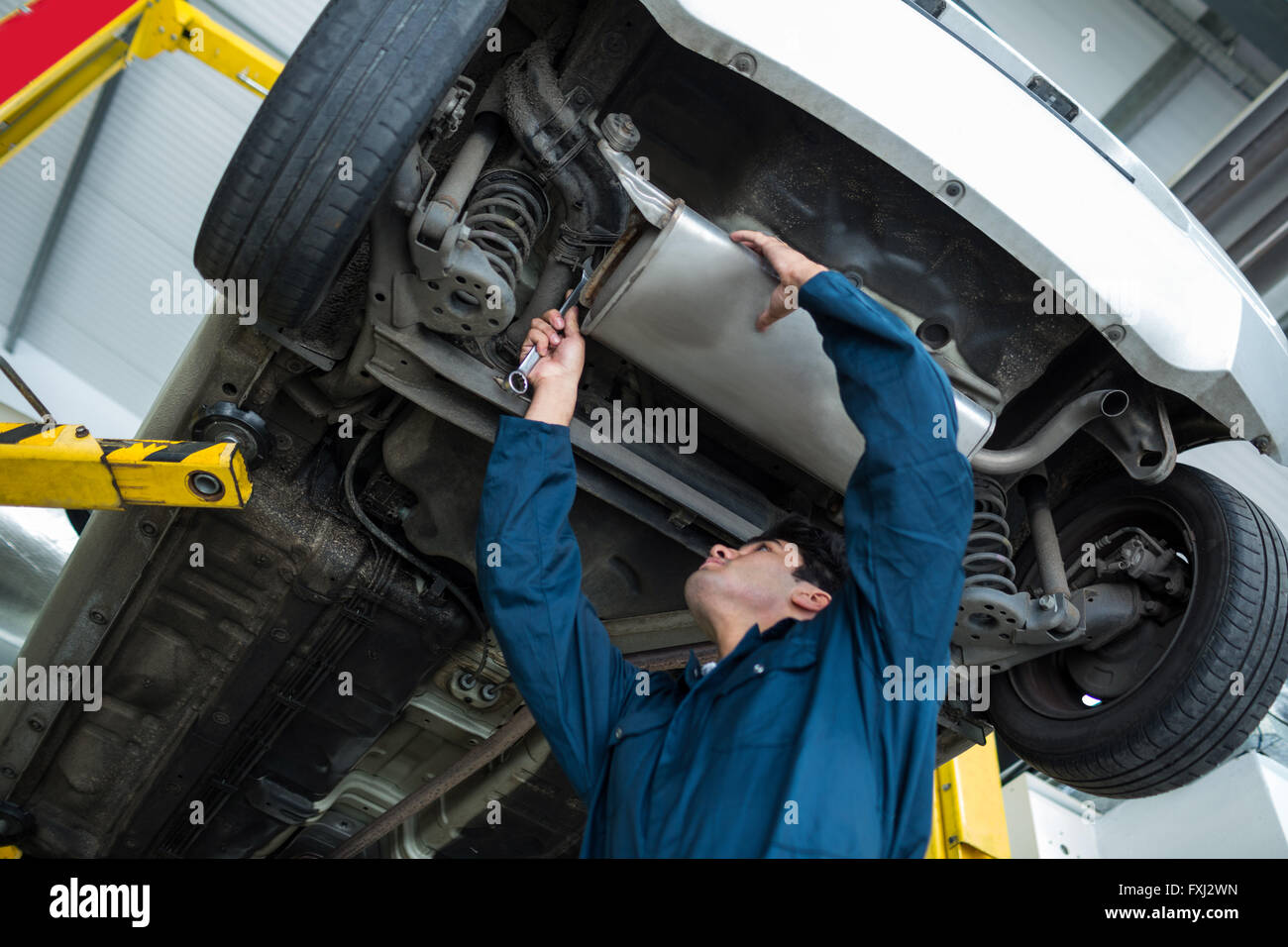 Mechanic repairing a car Stock Photo - Alamy
