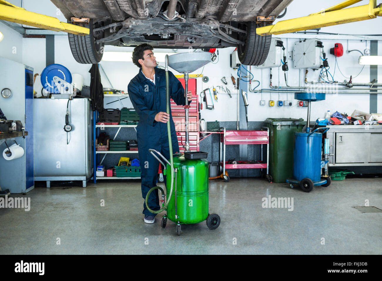 Mechanic servicing a car Stock Photo - Alamy