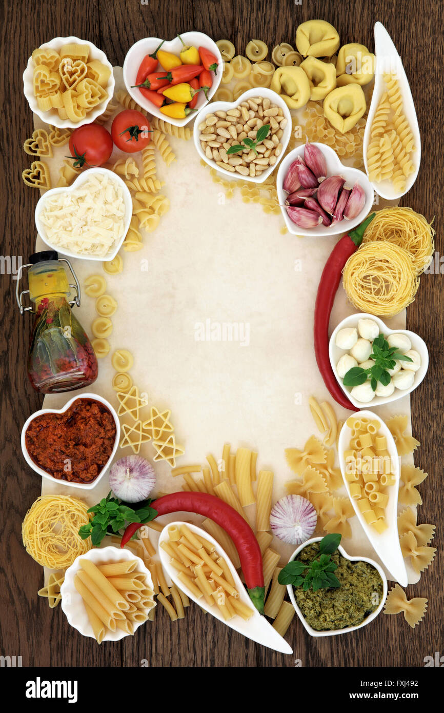 Italian pasta and food ingredients forming an abstract border over old ...