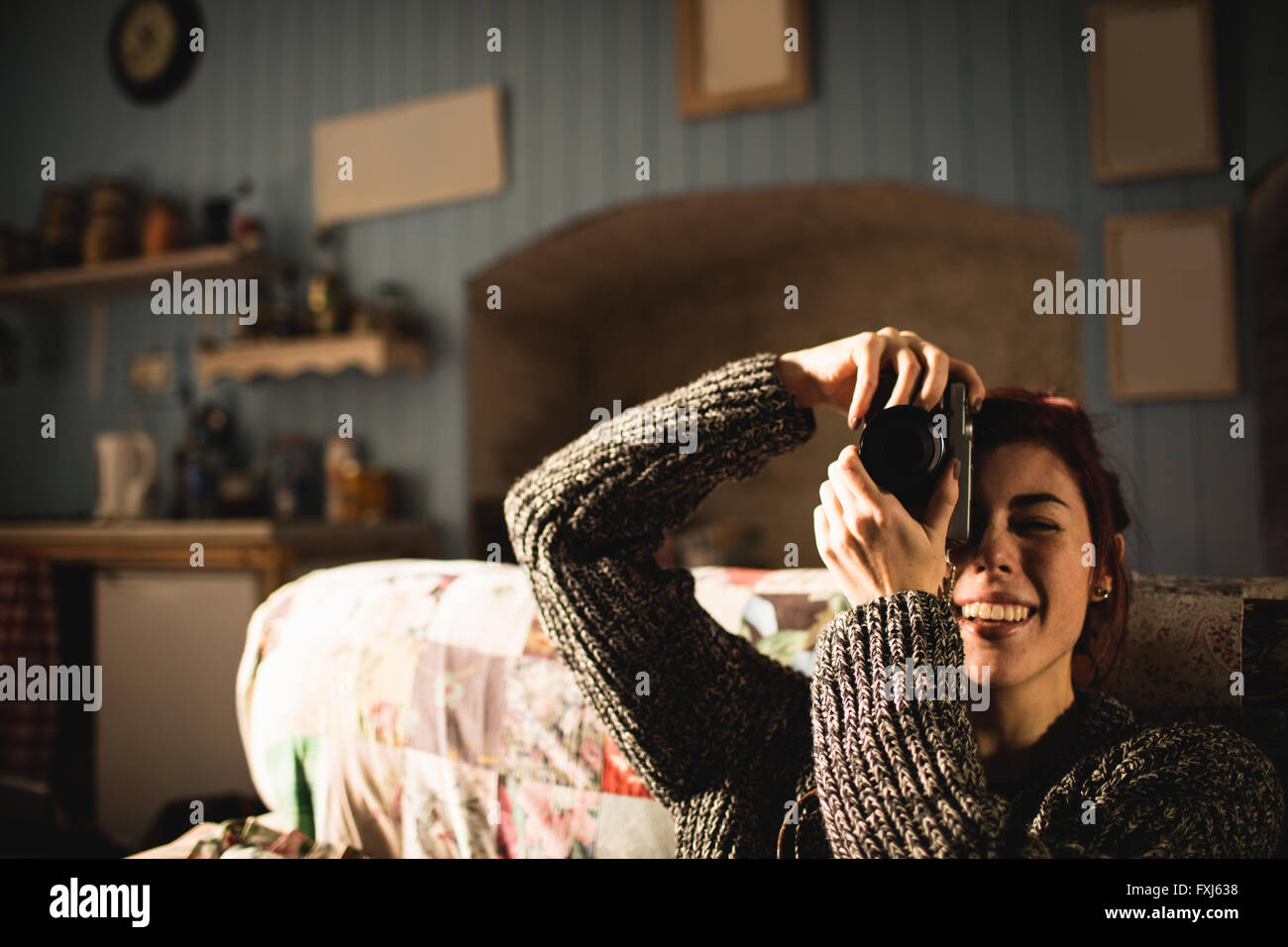 Young woman taking a picture with her camera Stock Photo - Alamy