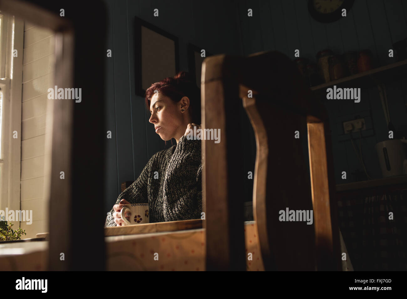 Young woman sitting dining table hi-res stock photography and images ...