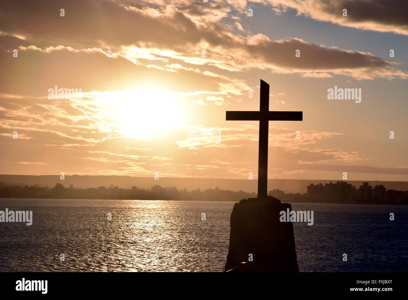 Cross at sunset Stock Photo - Alamy