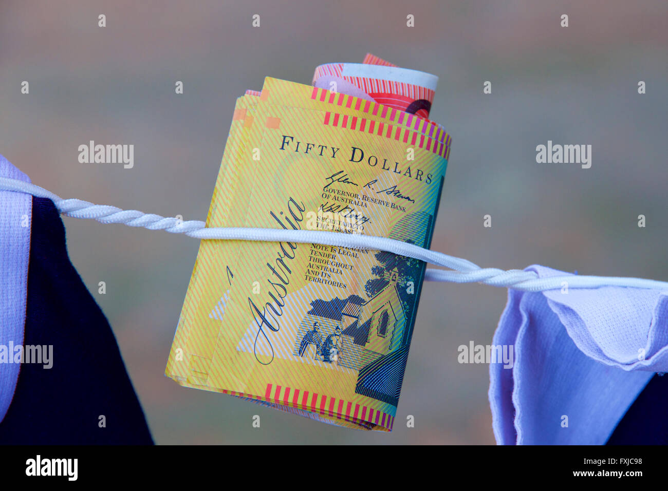 Money hanging out dry hi-res stock photography and images - Alamy