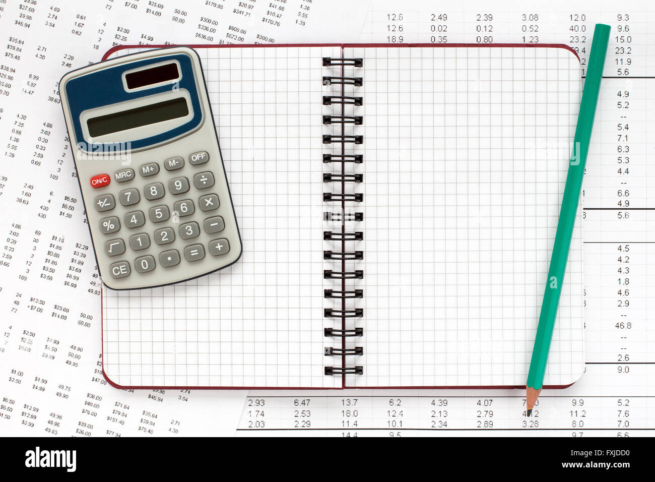 Calculator and spiral notebook on financial statement , concept of ...