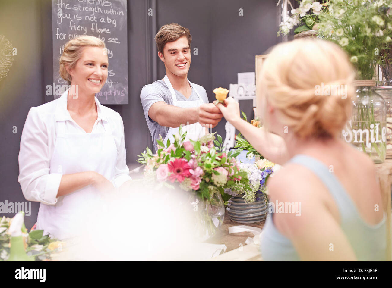 Woman receiving flower hi-res stock photography and images - Alamy