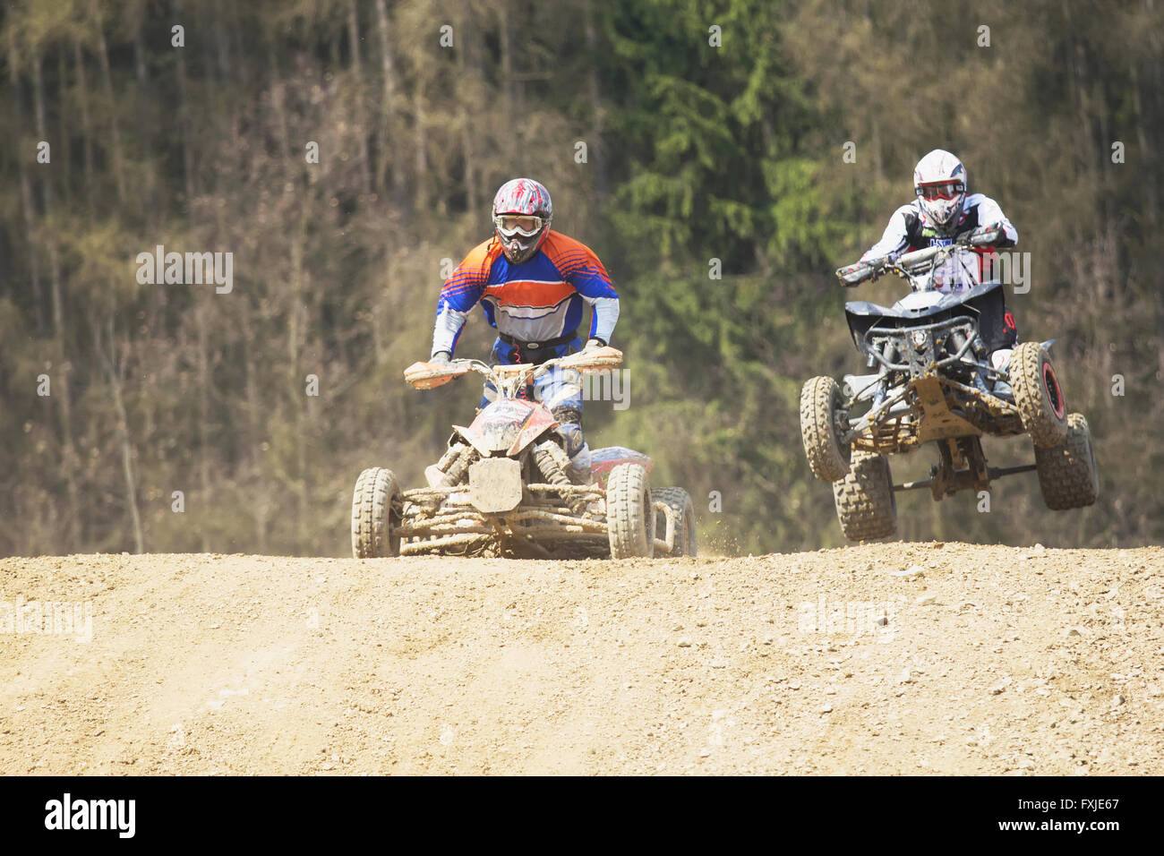 Two racers on a quad motorbike in the race Stock Photo - Alamy