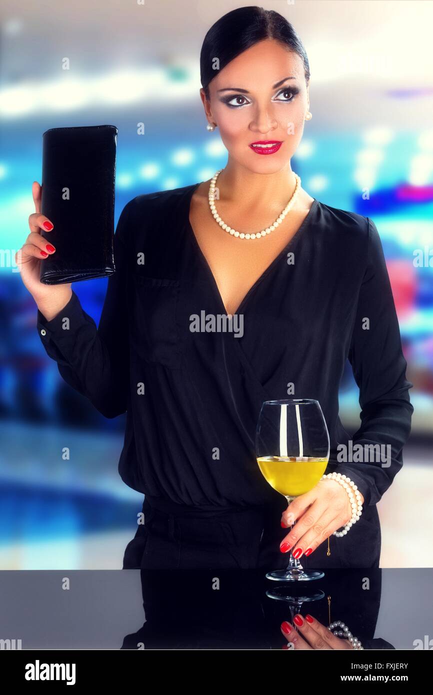 Elegant young female,drinking wine Stock Photo - Alamy