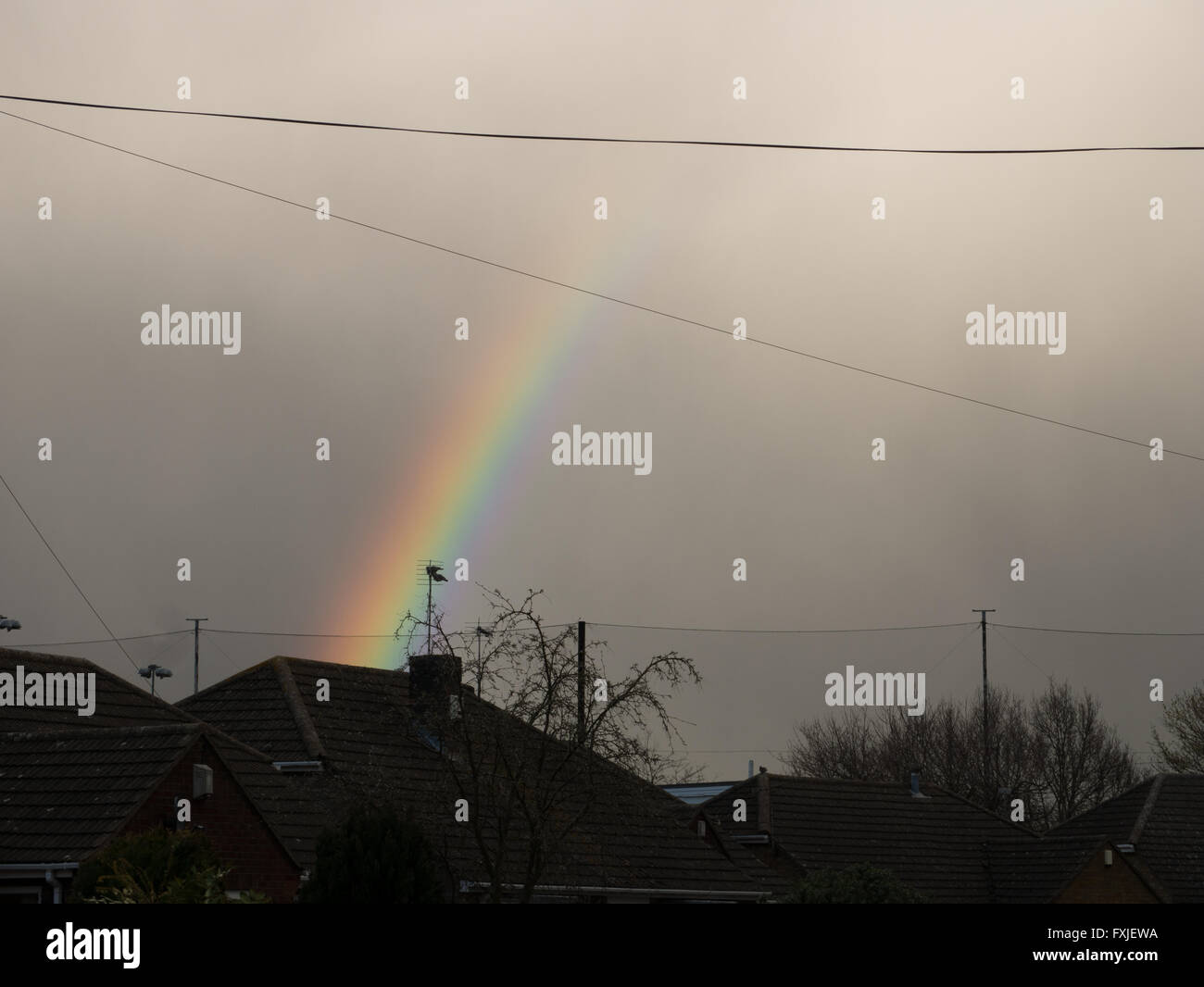 Passing storm reveals partial rainbow Stock Photo - Alamy Passing storm reveals partial rainbow Stock Photo - Alamy