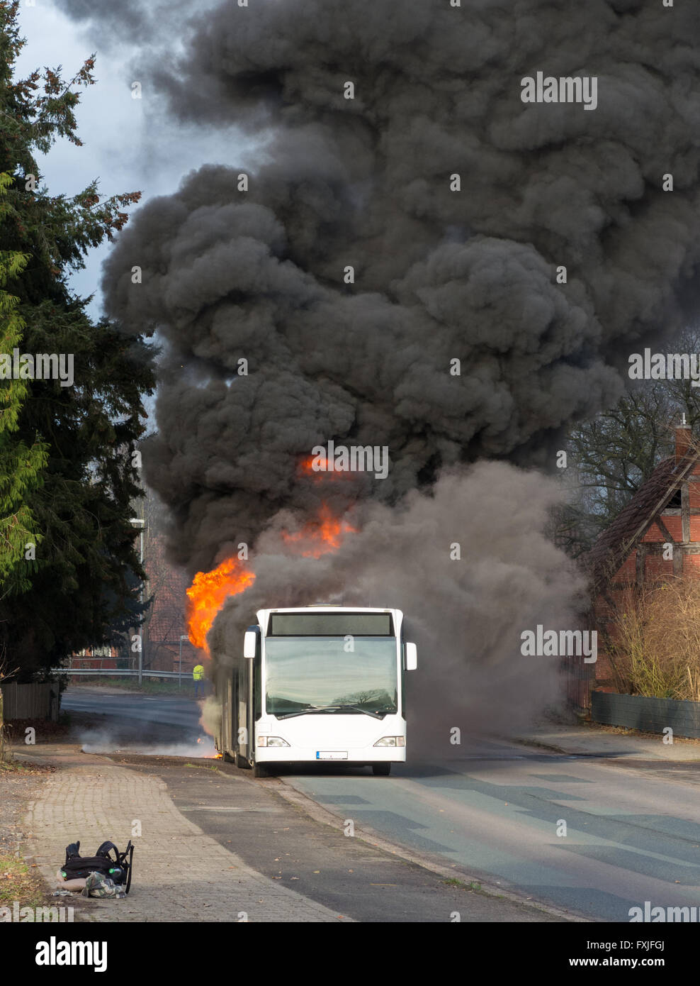 Burning school bus on a road in Sebbenhausen, community Balge Stock ...